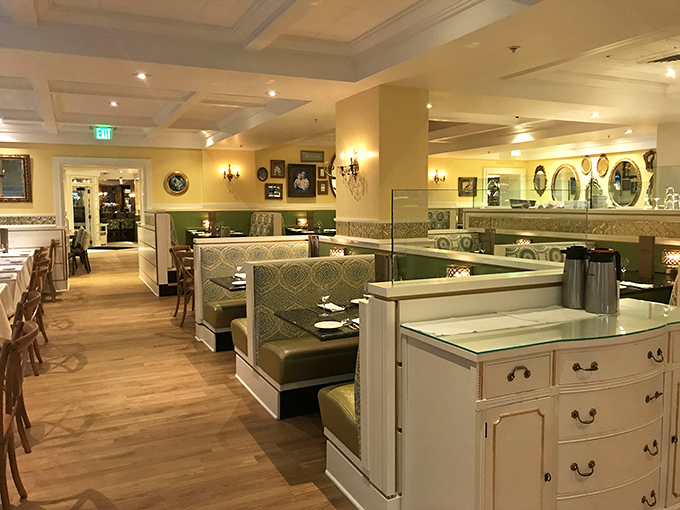 The dining room feels like the sophisticated living room you wish you had, where chandeliers and comfort food coexist in perfect harmony. 