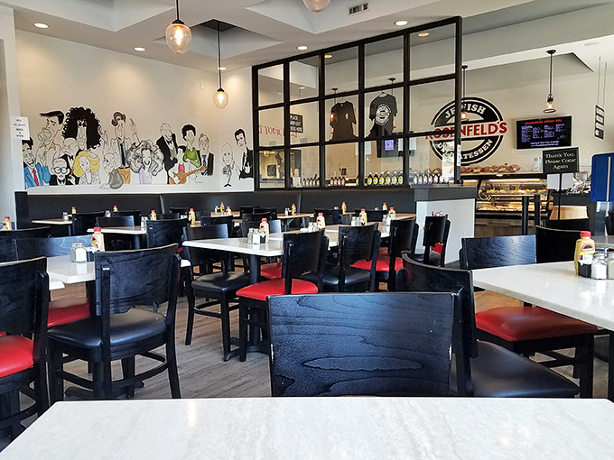 Modern meets traditional in this thoughtfully designed dining room. The caricature wall art tells stories while you create your own over shared pickles.