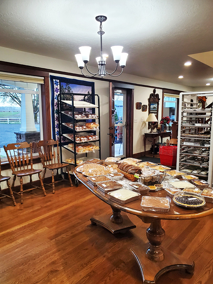 The cozy seating area invites you to linger, with quilts and a grandfather clock standing guard over your moment of pastry bliss. 