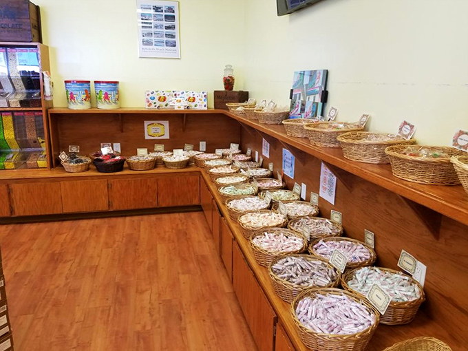 Old-school wooden shelving lined with wicker baskets creates the perfect nostalgic backdrop for some serious candy contemplation and selection.