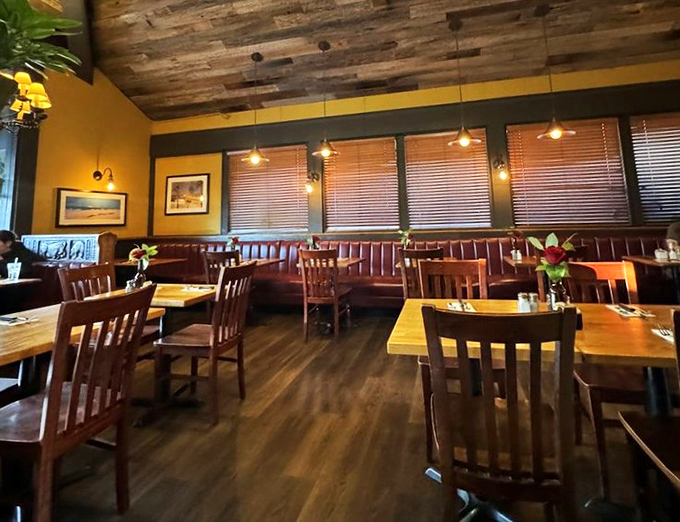 The dining room whispers "stay awhile" with its rustic ceiling and warm lighting. It's like someone designed the perfect backdrop for your food memories.