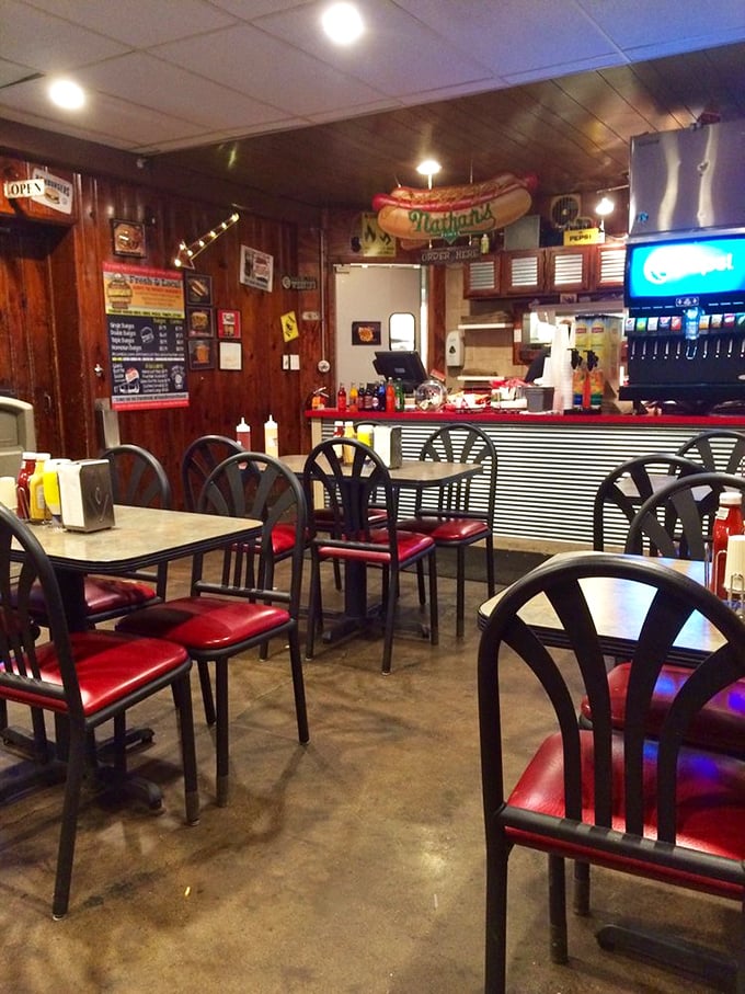 The wood-paneled sanctuary where burger dreams come true. Every scratch on these tables tells the story of a satisfied customer.