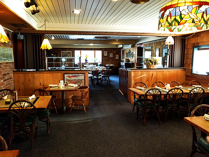 The dining room's rattan chairs and wooden tables create that classic "New England fish house" vibe that somehow makes seafood taste 30% better. 