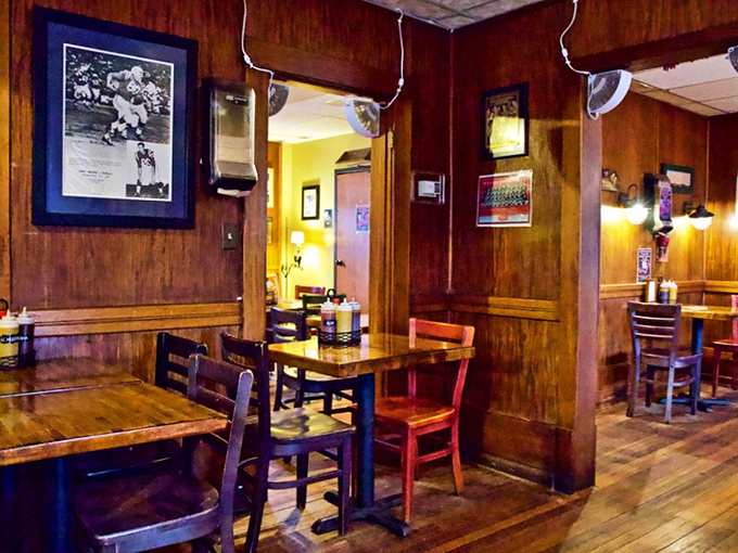 Wood-paneled walls lined with football memorabilia tell the story of Andy Nelson's journey from NFL player to barbecue legend.