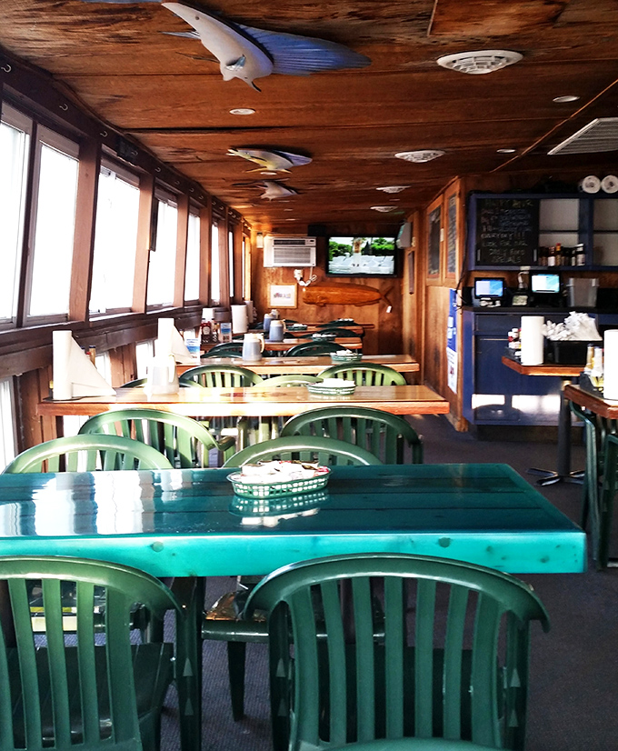 Wooden walls, fish mounts, and windows framing the water &ndash; nautical charm you can't manufacture with a designer's budget.