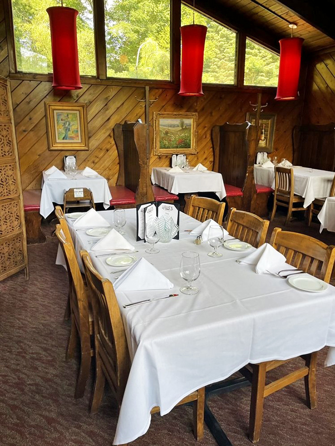The dining room where memories are made, one perfectly timed bite after another, all under the warm glow of those signature red pendants.