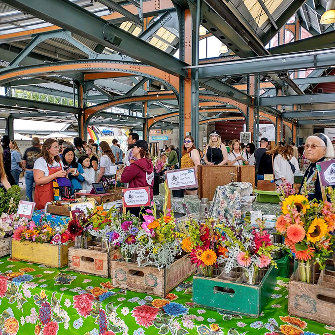 Flower power at the local market, where vibrant blooms in vintage crates bring color and joy to weekend shopping adventures.