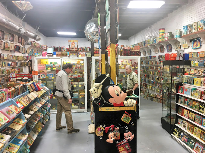 Mickey Mouse stands guard over his lunchbox kingdom, proving that some cultural icons never lose their ability to make us smile.