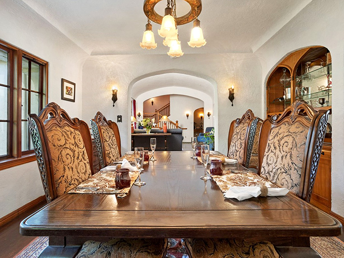 Dining room or medieval banquet hall? Those chairs look like they've hosted conversations worthy of their ornate carvings.