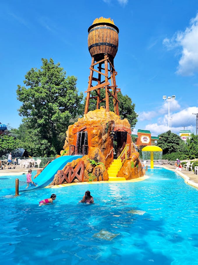 This outdoor water tower feature is what happens when Ozark charm meets aquatic engineering &ndash; a splash zone disguised as rustic architecture.