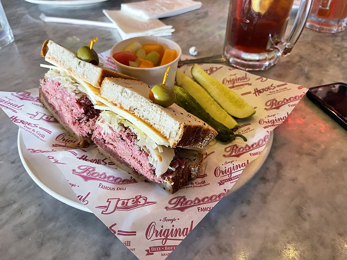 This pastrami masterpiece has more layers than your favorite Netflix drama. The marble table underneath knows it's hosting greatness.