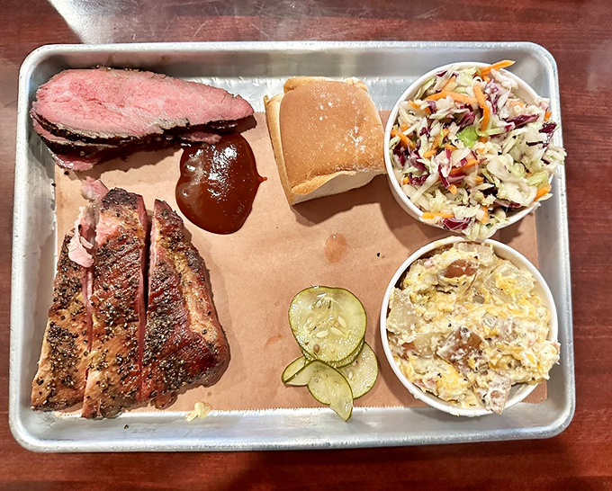 Meat candy for grown-ups: perfectly pink-centered tri-tip and bark-crusted brisket sharing a tray with sides that know their supporting role.