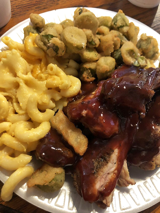 Whoever decided to pair crispy fried okra with mac and cheese and saucy ribs deserves some kind of culinary Nobel Prize.