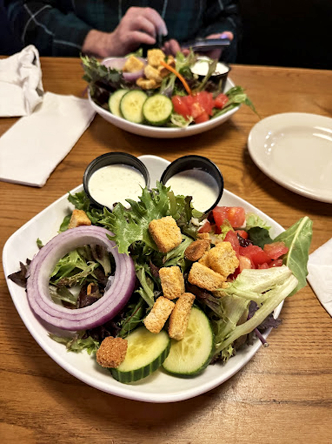 A salad that doesn't apologize for being healthy, brightened with purple onion rings and cucumber coins that add crunch to every bite.