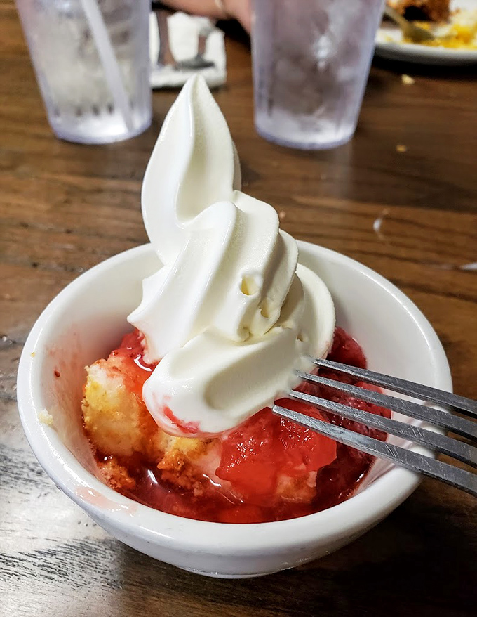 Strawberry shortcake that would make your grandmother proud—or slightly jealous. That soft-serve ice cream spiral is engineering perfection.