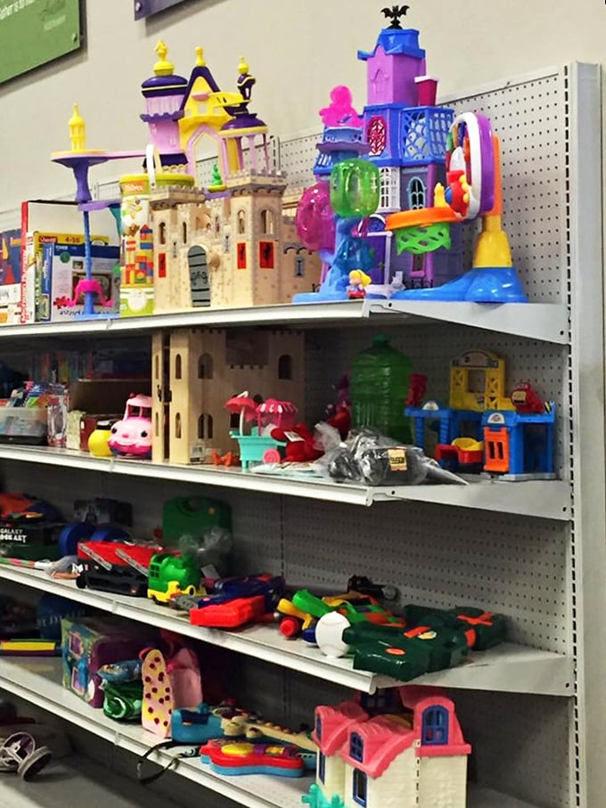 Toy castles and playsets waiting for imaginative new owners. That purple castle might just become some lucky kid's favorite enchanted kingdom.