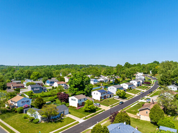 Hockessin's aerial view reveals its perfect blend of residential comfort and natural beauty. Retirement living with trees instead of traffic jams.