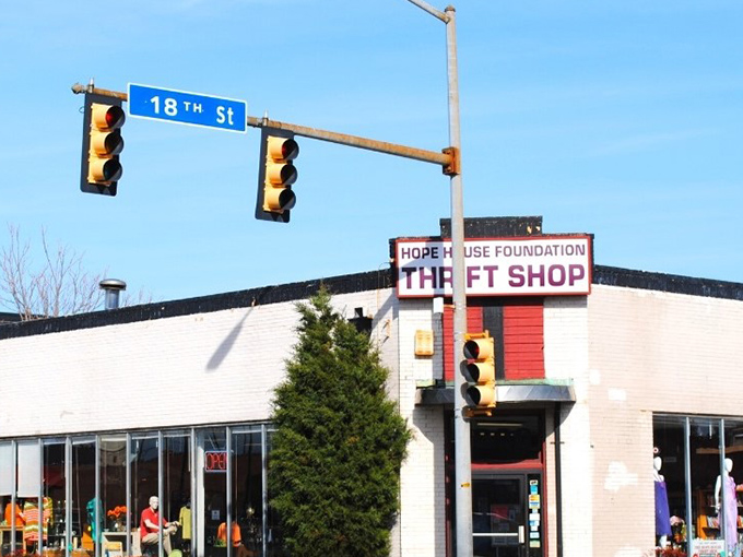 Hope House Thrift Shop sits at the corner of Bargain Street and Community Spirit. The traffic light says GO... shopping!