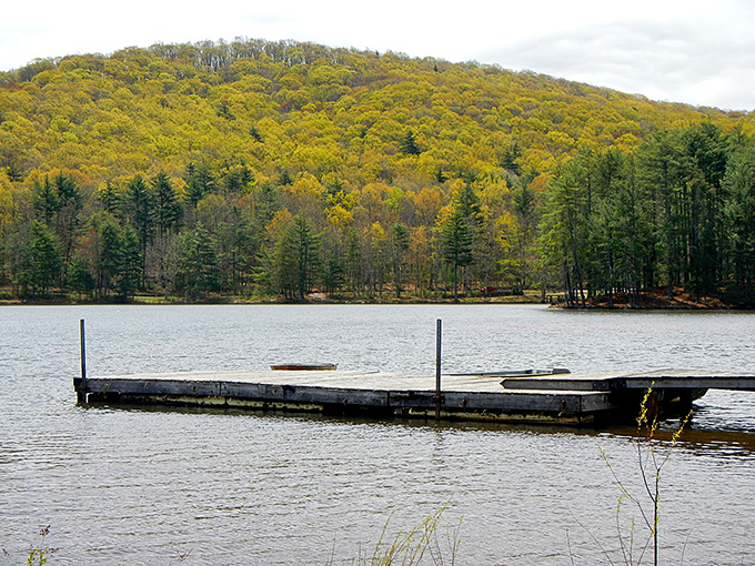 Moncove Lake at golden hour—when the water turns to liquid amber and time seems to stand perfectly still.