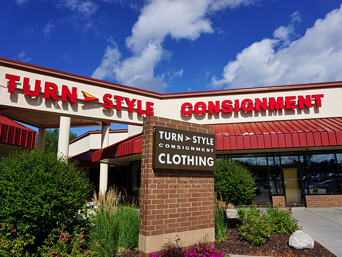 Turn Style's distinctive red signage pops against the blue sky like a fashion exclamation point. Consignment with confidence!