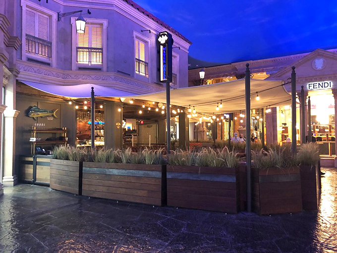 Water Grill's elegant patio creates a coastal oasis amid the Vegas chaos &ndash; string lights and seafood make magic happen.