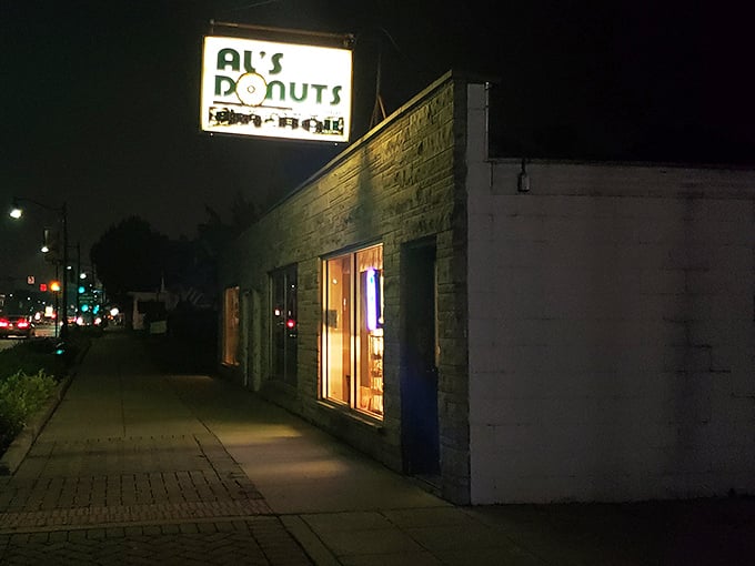 Al's Donuts: By day, an unassuming stone building. By night, a glowing temple of fried dough that beckons night owls.