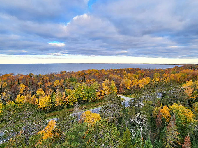 Lake Superior's autumn shoreline viewed from above – nature's confetti celebration that makes you glad you brought your camera.