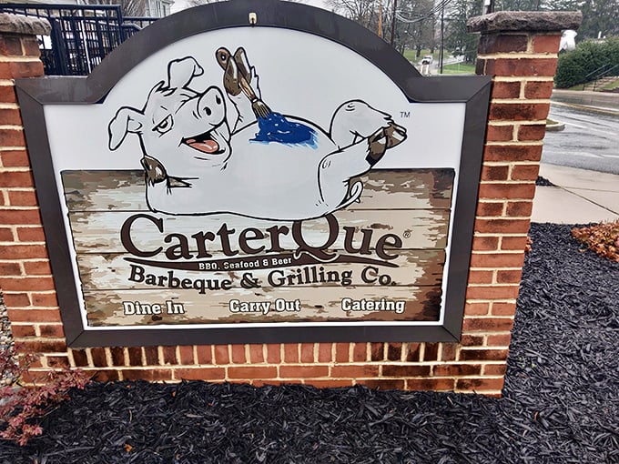 The American flag flies proudly at CarterQue, reminding us that transforming tough cuts into tender barbecue is quintessentially American.