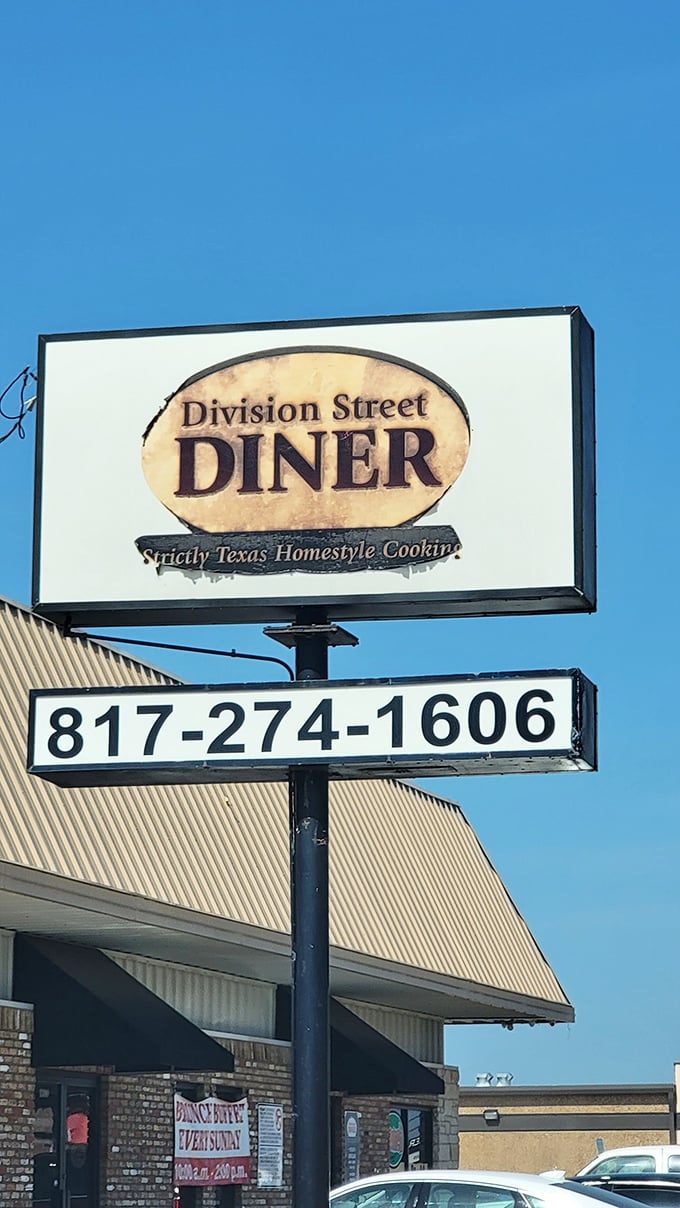 That weathered sign speaks volumes – Division Street Diner has been perfecting breakfast long enough to earn its vintage patina.