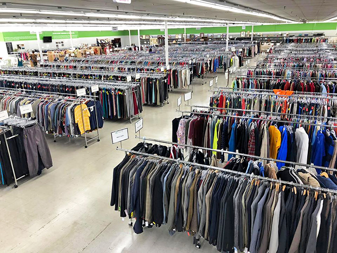 A sea of carefully organized clothing racks stretches to the horizon. Mission Mart turns "overwhelming selection" into an art form.