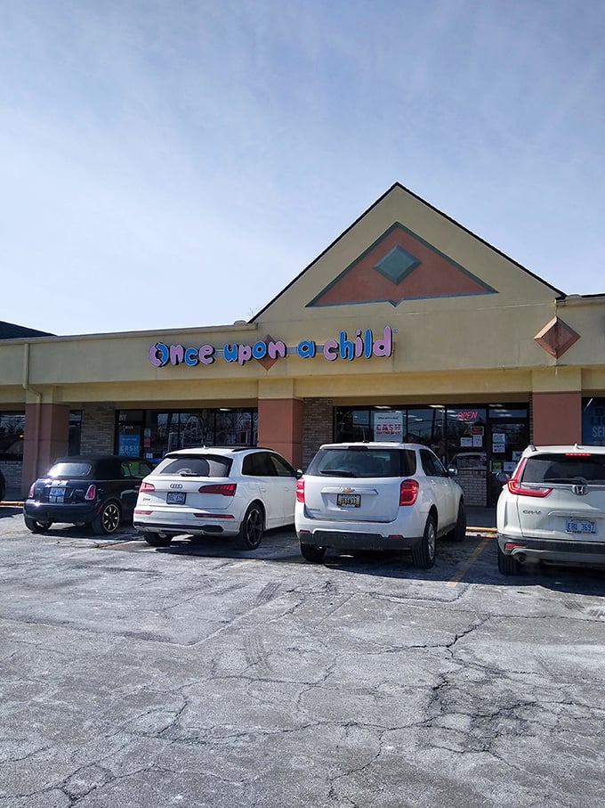 The colorful signage of Once Upon A Child hints at the rainbow of tiny treasures waiting inside for growing families.