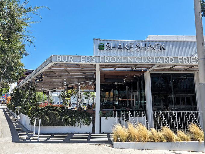 Shake Shack's California presence brings East Coast burger diplomacy to the Golden State. That illuminated signage promises smashed patty perfection that transcends coastal rivalries.
