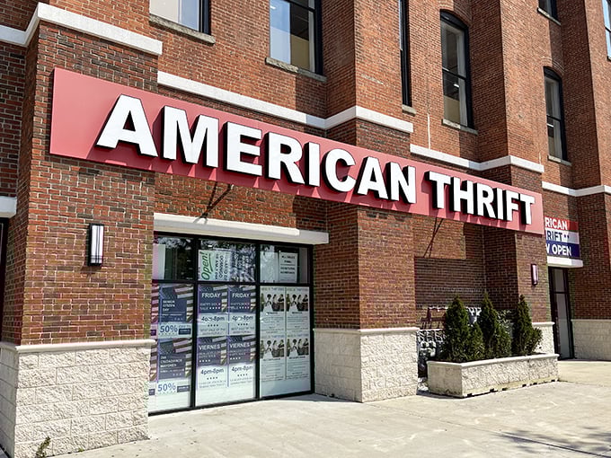 The brick facade of American Thrift Store stands like a temple to secondhand treasures, its bold red sign beckoning bargain hunters and nostalgia seekers alike.