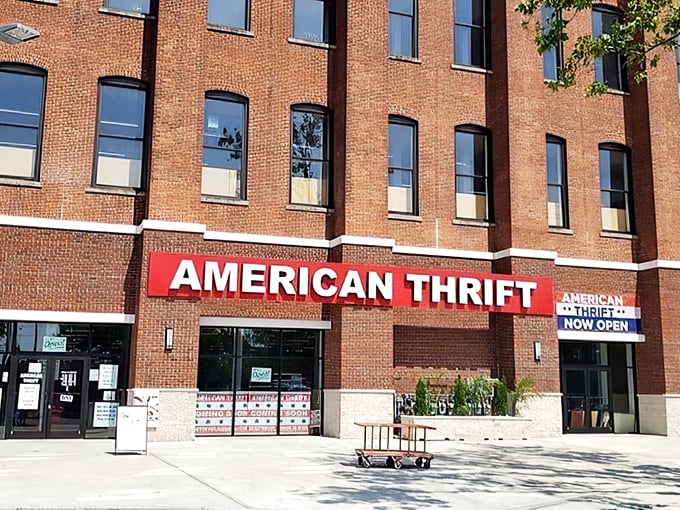 The brick facade of American Thrift Store stands like a temple to secondhand treasures, its bold red sign beckoning bargain hunters and nostalgia seekers alike.