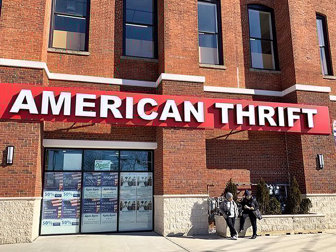 The brick facade of American Thrift Store stands like a temple to secondhand treasures, its bold red sign beckoning bargain hunters and nostalgia seekers alike.