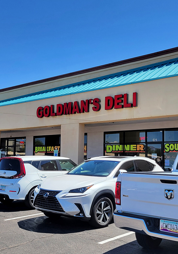 Welcome to sandwich paradise! Goldman's Deli stands proud, its neon sign a beacon for hungry souls seeking deli nirvana.