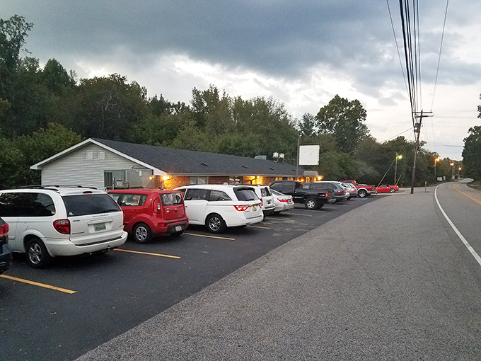 The lighthouse beckons! Fish Creel's iconic red and white tower stands as a quirky landmark, promising seafood treasures in landlocked northern Alabama.