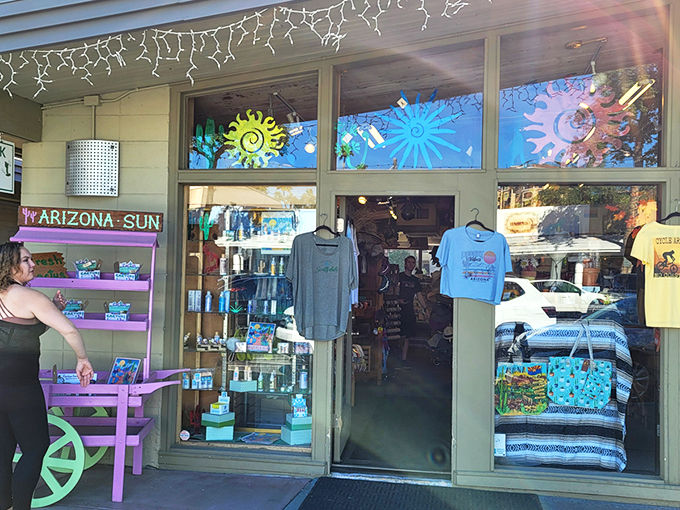 The unassuming storefront of Kactus Jock beckons with colorful displays that spill onto the sidewalk, promising treasures within that celebrate all things Arizona.