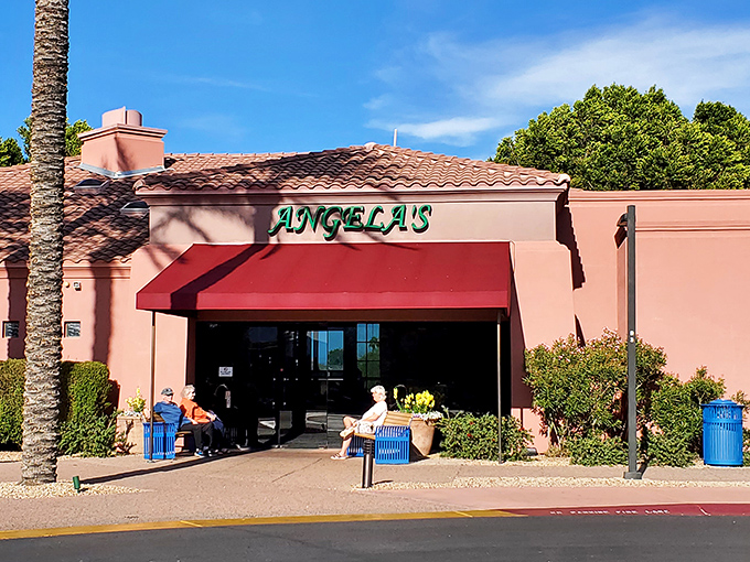 Angela's Kitchen welcomes you with its warm terracotta exterior and vibrant red awning&mdash;like a sunset-colored beacon for hungry souls in Surprise.