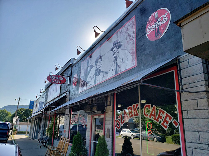 The black facade of Ozark Cafe stands proudly on Jasper's main street, vintage photos and that classic Coca-Cola signage promising authentic Arkansas comfort within.