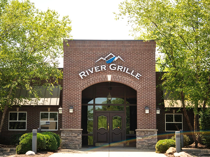 The brick fa&ccedil;ade of River Grille stands like a culinary fortress, promising treasures within that make the journey to Bentonville worthwhile.
