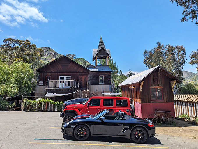 The Old Place stands proudly against the California sky, its weathered wooden exterior and bell tower looking like they've been waiting for John Wayne to ride up.