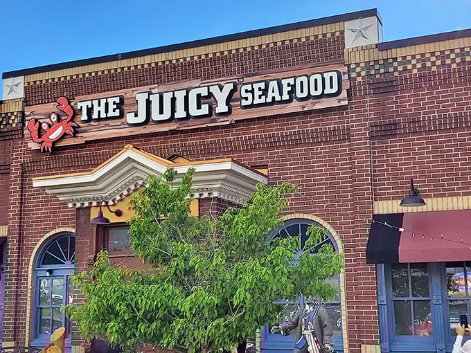 The brick facade of The Juicy Seafood stands like a culinary lighthouse in Colorado Springs, promising oceanic treasures within its unassuming exterior.