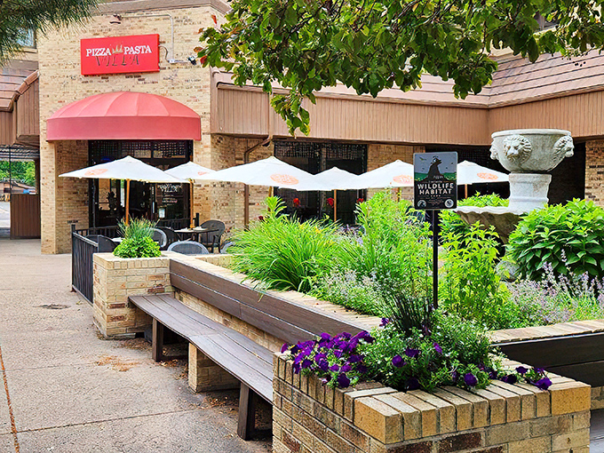 The welcoming storefront of Pizza Pasta Villa announces itself without fanfare&mdash;just a simple red sign promising honest Italian comfort that delivers every time.