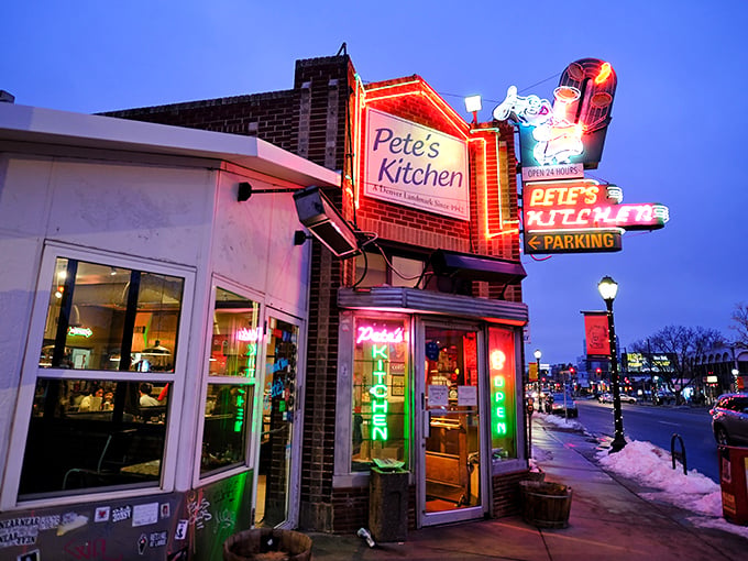 The neon glow of Pete's Kitchen at dusk isn't just a sign—it's a beacon of hope for hungry souls wandering Colfax Avenue.