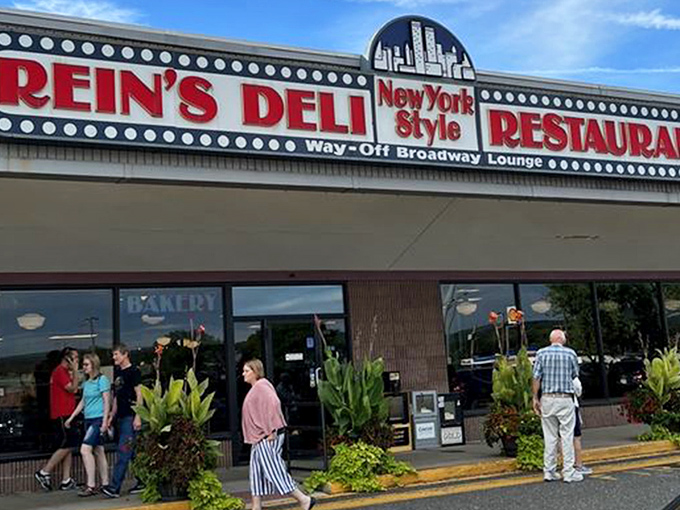 The iconic yellow exterior of Rein's Deli stands like a beacon of hope for hungry travelers on I-84, promising New York deli salvation in Connecticut.