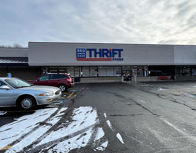 The patriotic facade of Red White & Blue Thrift Store stands proudly against a blue Connecticut sky, like a bargain-hunter's version of the Promised Land. 