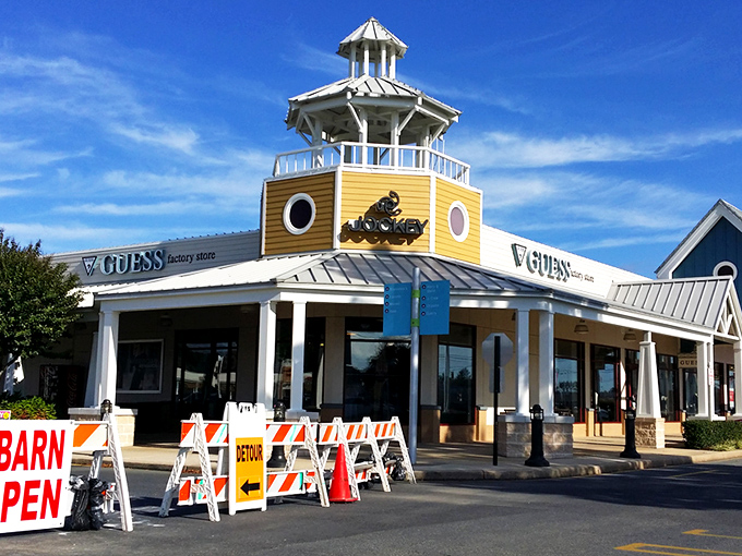 The iconic lighthouse-topped GUESS storefront welcomes shoppers like a beacon of bargains. Coastal charm meets retail therapy in this architectural gem.