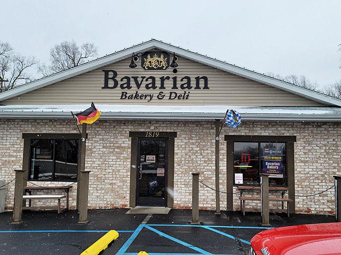 The Bavarian dream awaits! This charming stone-faced building with its distinctive flags and royal crest promises authentic German delights inside.