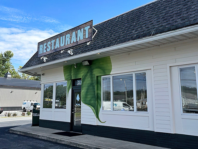 The modest lime-green exterior of The Backyard hides culinary treasures within, proving you should never judge a restaurant by its siding.